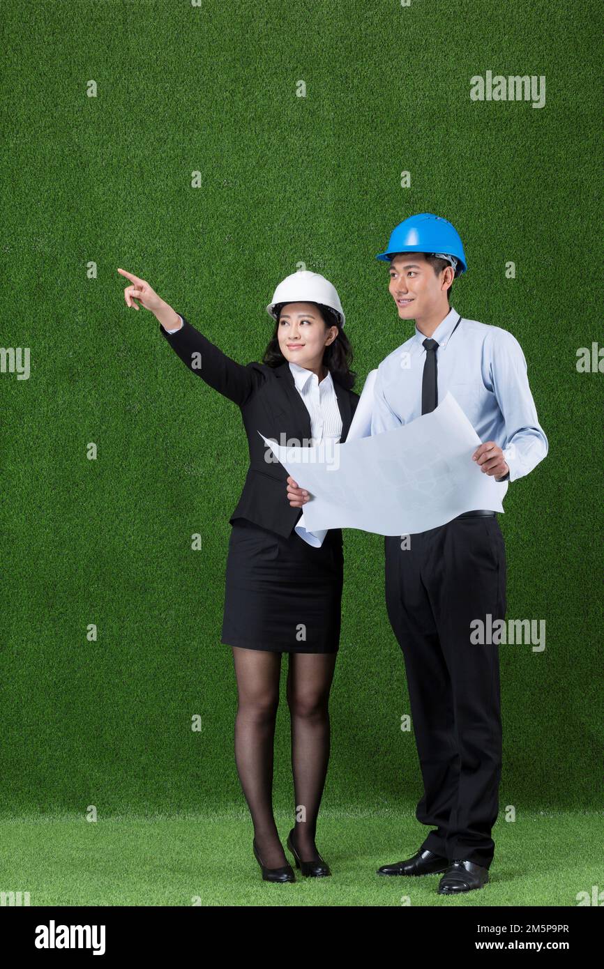 The grass business designers take drawings to the distance Stock Photo ...