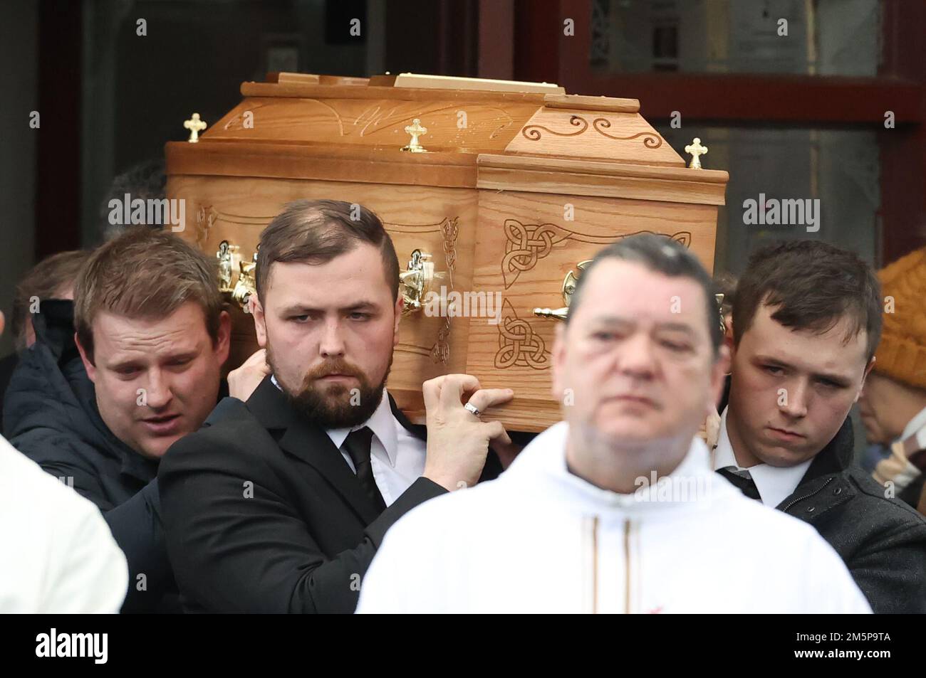 The coffin of Patrick Rogers is carried from his funeral service at St ...