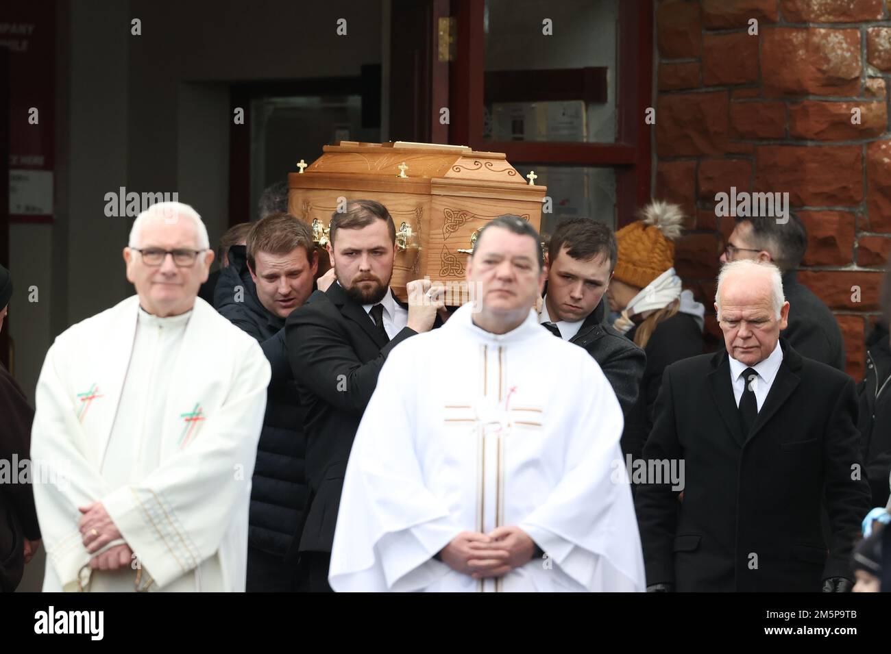 The coffin of Patrick Rogers is carried from his funeral service at St ...