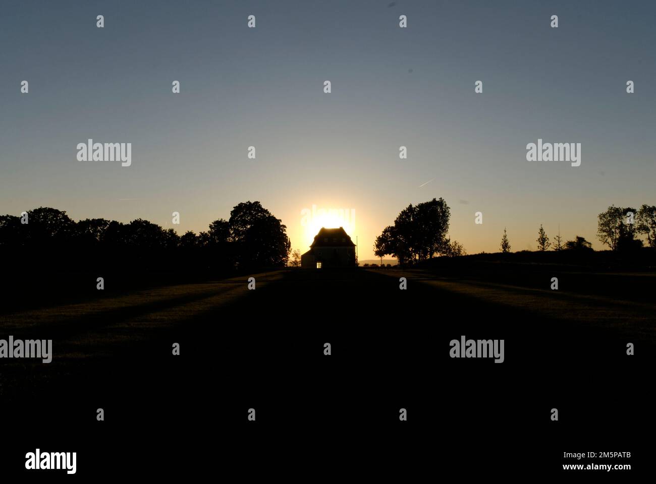 Beautiful sunsets over land and civilization Stock Photo - Alamy