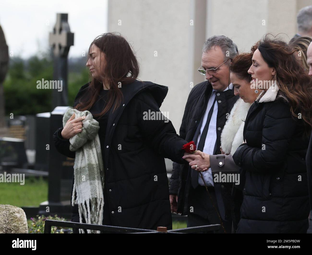 Family and friends walk behind the coffin of Patrick Rogers as it is ...