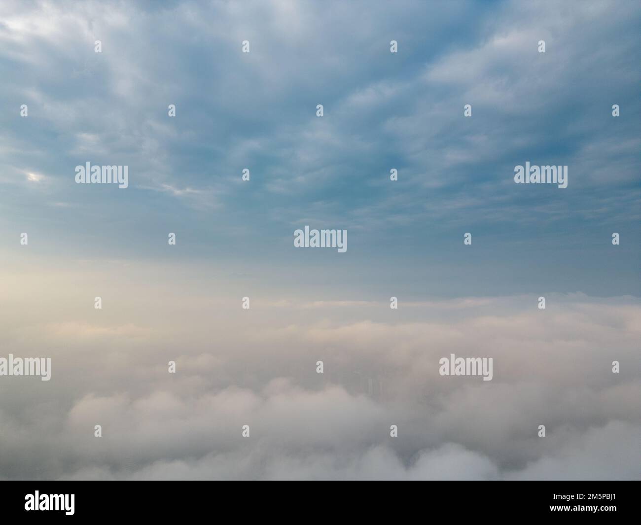 A landscape aerial view of skyline with white clouds on the horizon ...