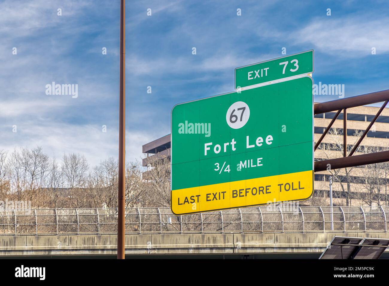 Large sign hanging over the road for exit 73 Stock Photo - Alamy