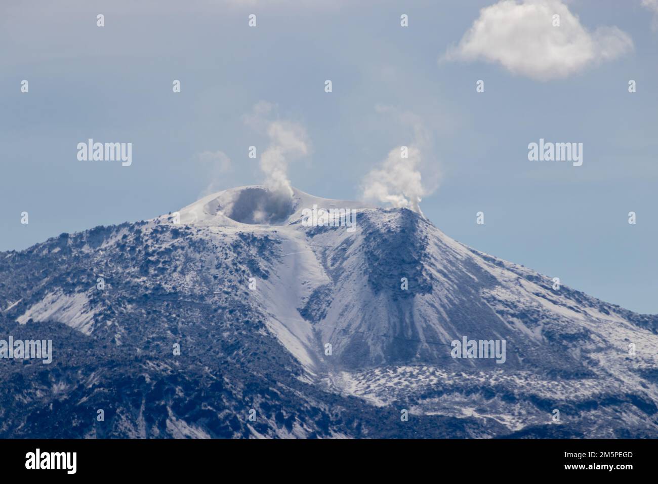 Snow covering the peaks of mountains in Atacama, the driest desert of ...