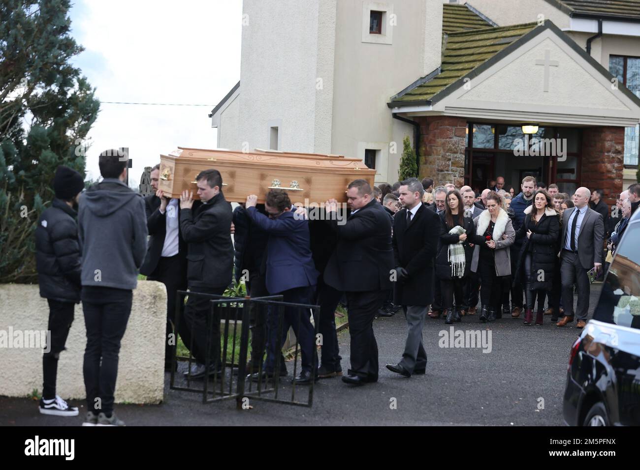 The coffin of Patrick Rogers is carried from his funeral service at St ...