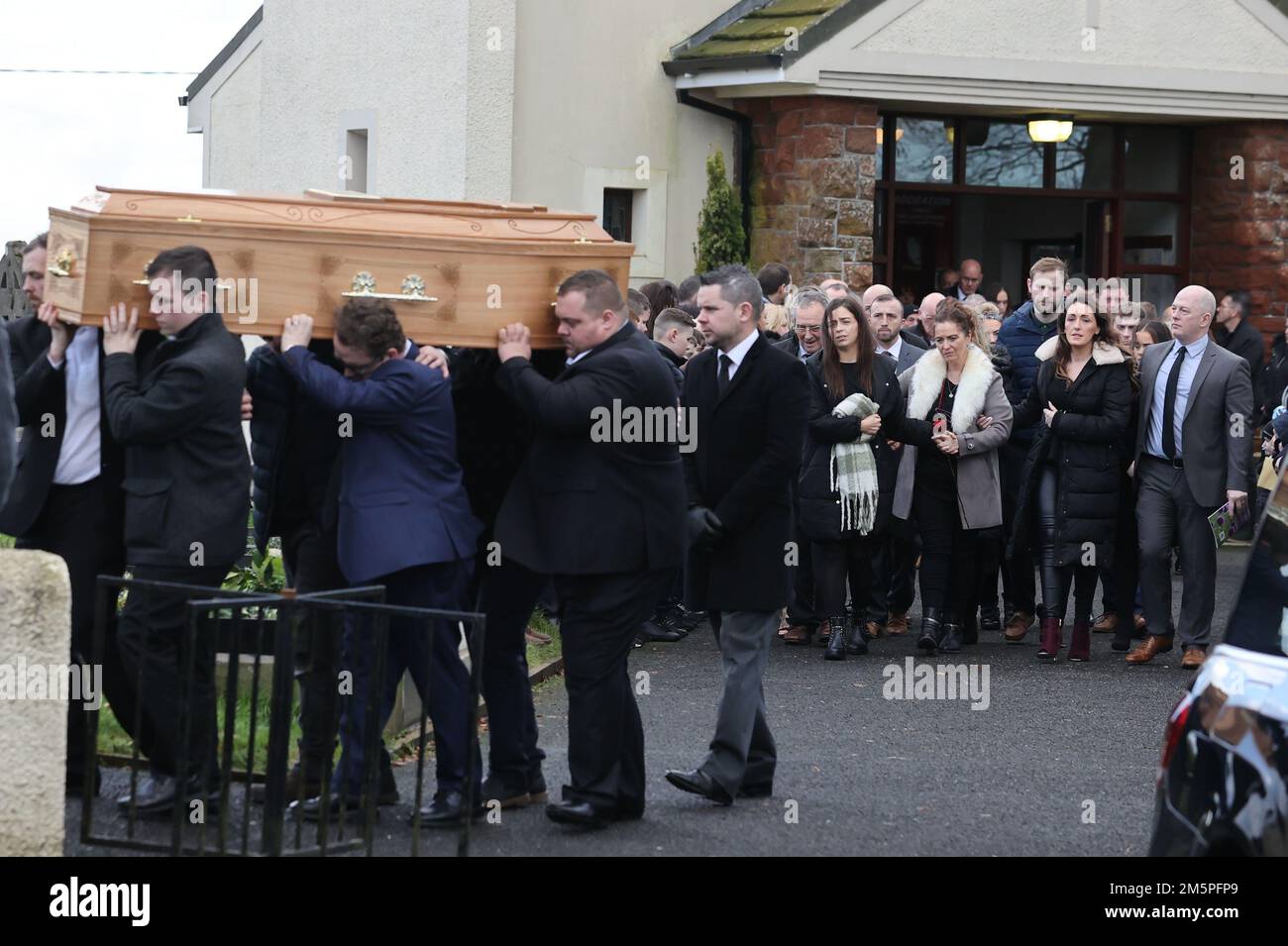 The coffin of Patrick Rogers is carried from his funeral service at St ...