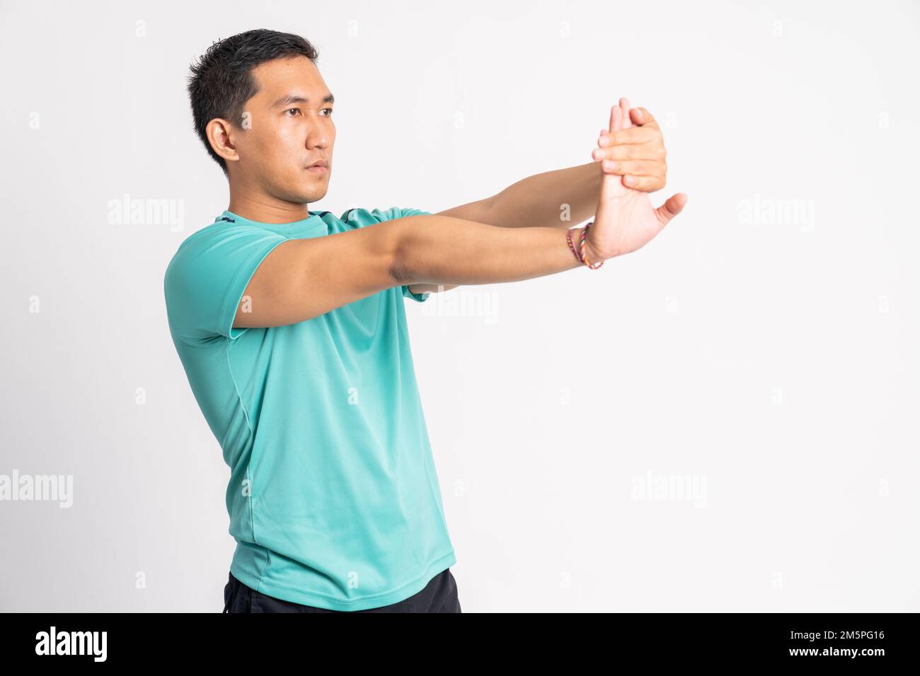 asian man stretching his hands pulling his fingers Stock Photo - Alamy