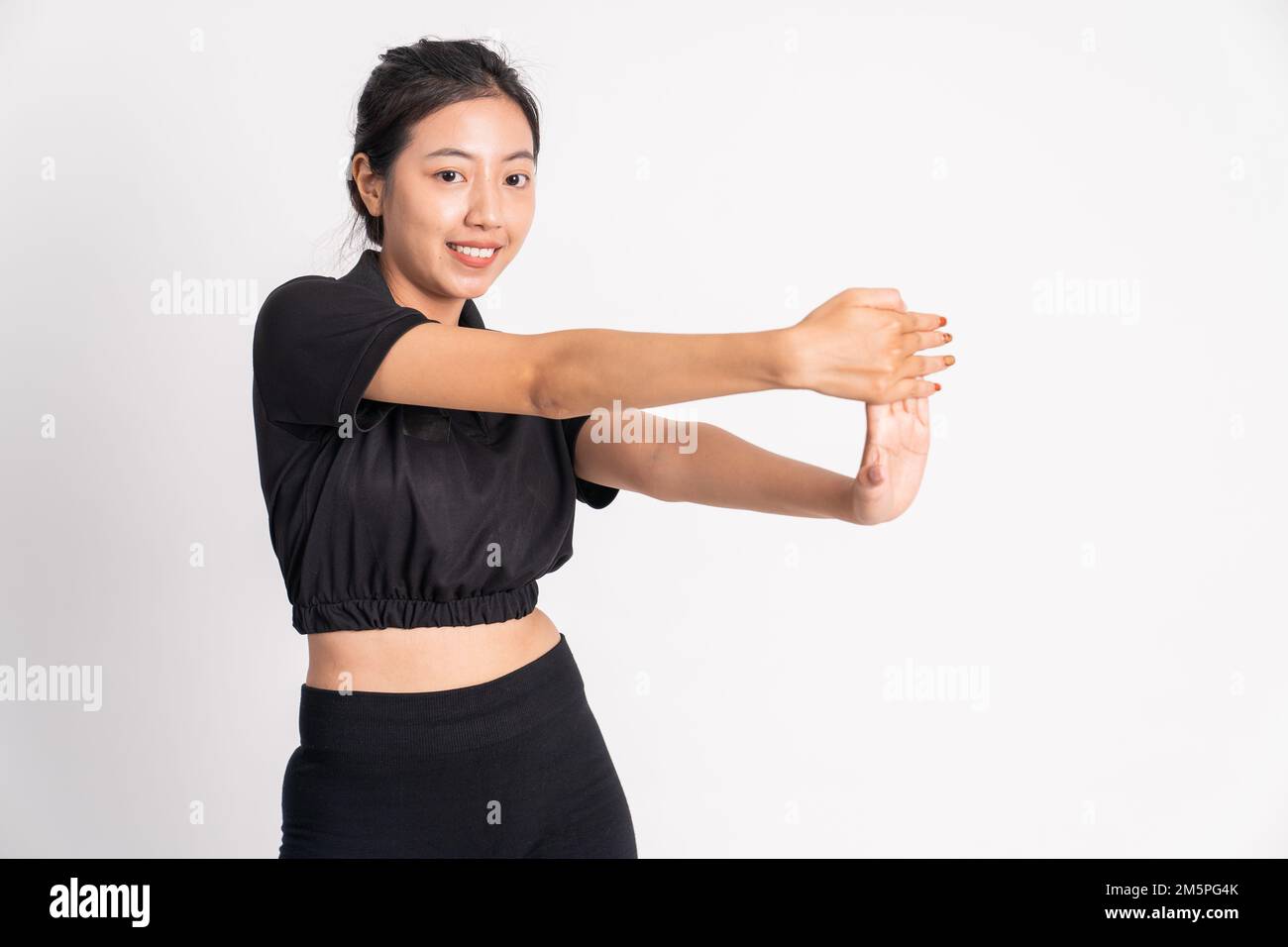 asian woman stretching her hand by pulling her finger Stock Photo - Alamy