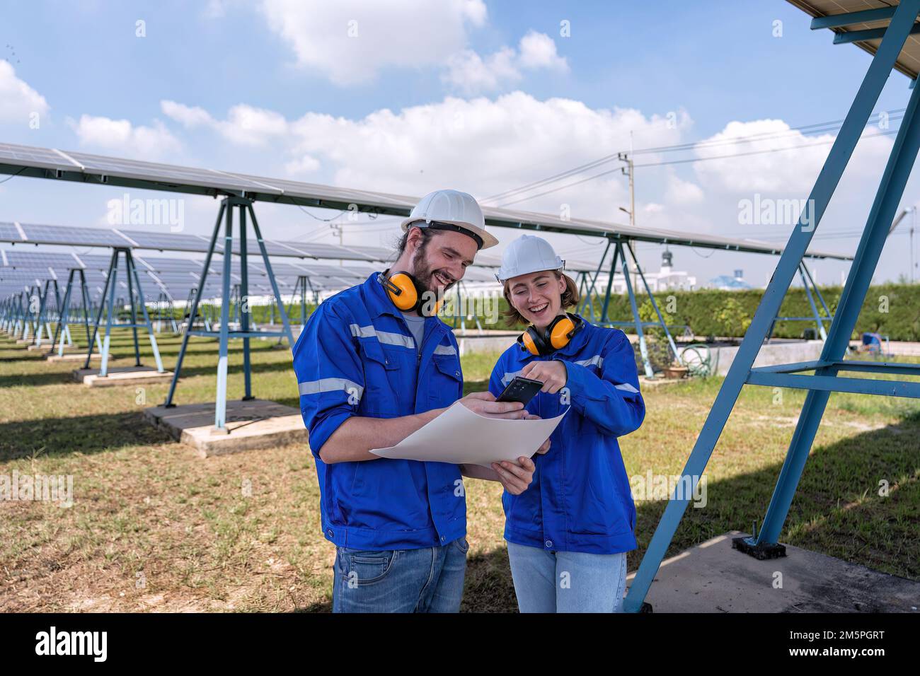 Engineer at solar farm on break time looking funny social media from ...