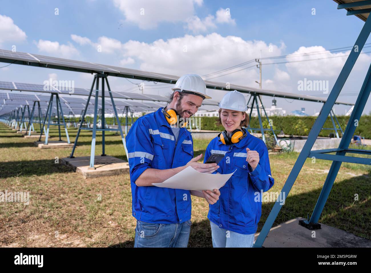 Engineer at solar farm on break time looking funny social media from ...