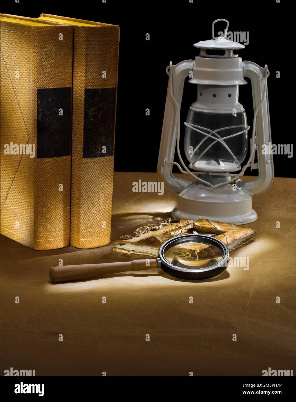 bokks oil lamp magnifier vintage notepad Stock Photo - Alamy