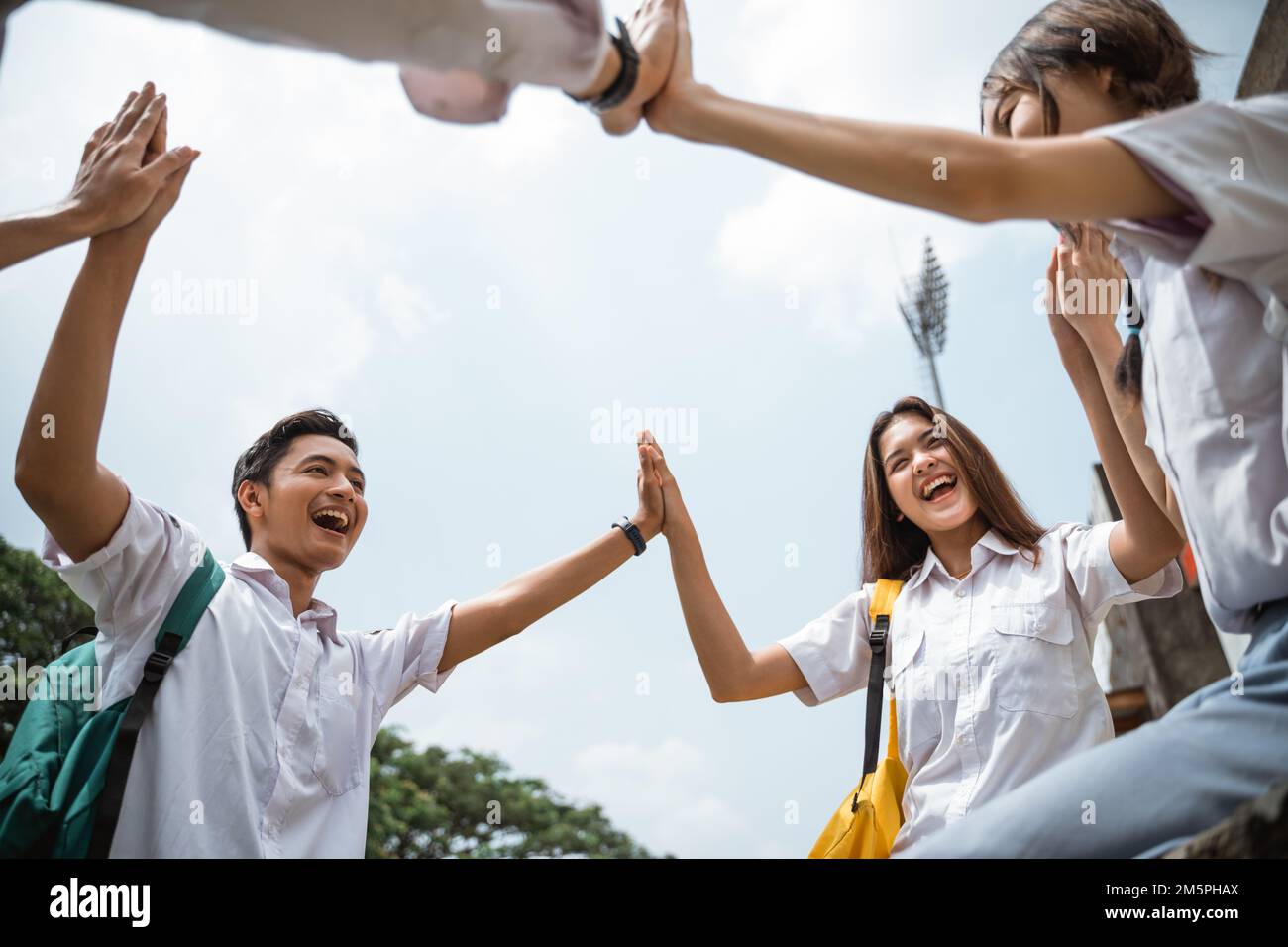 Group of high school students forming circle symbol of unity Stock ...