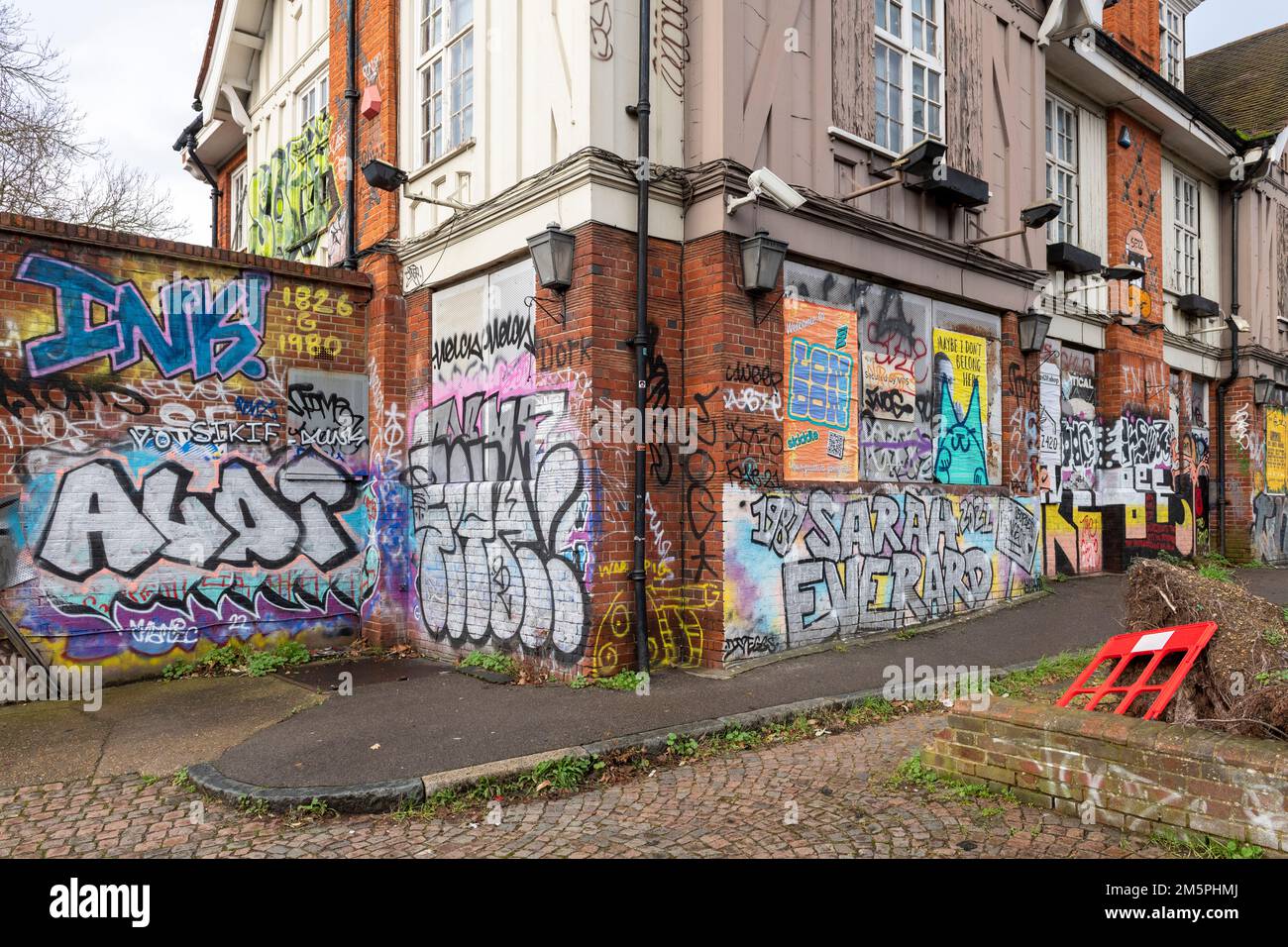 The closed down and vandalised Grove pub which is cover with fly ...
