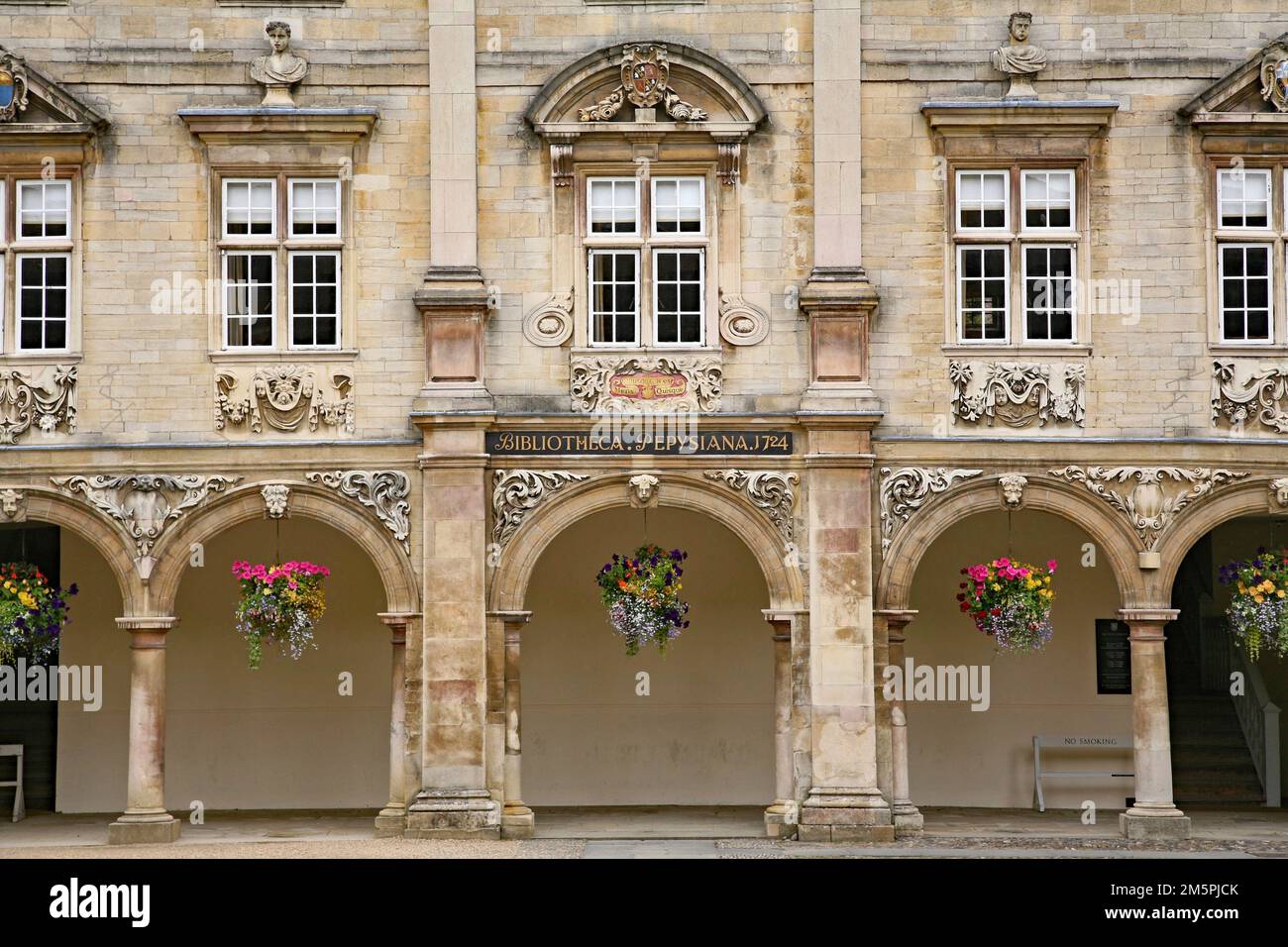 Ornate entrance to the Pepys Library building at Magdalene College ...