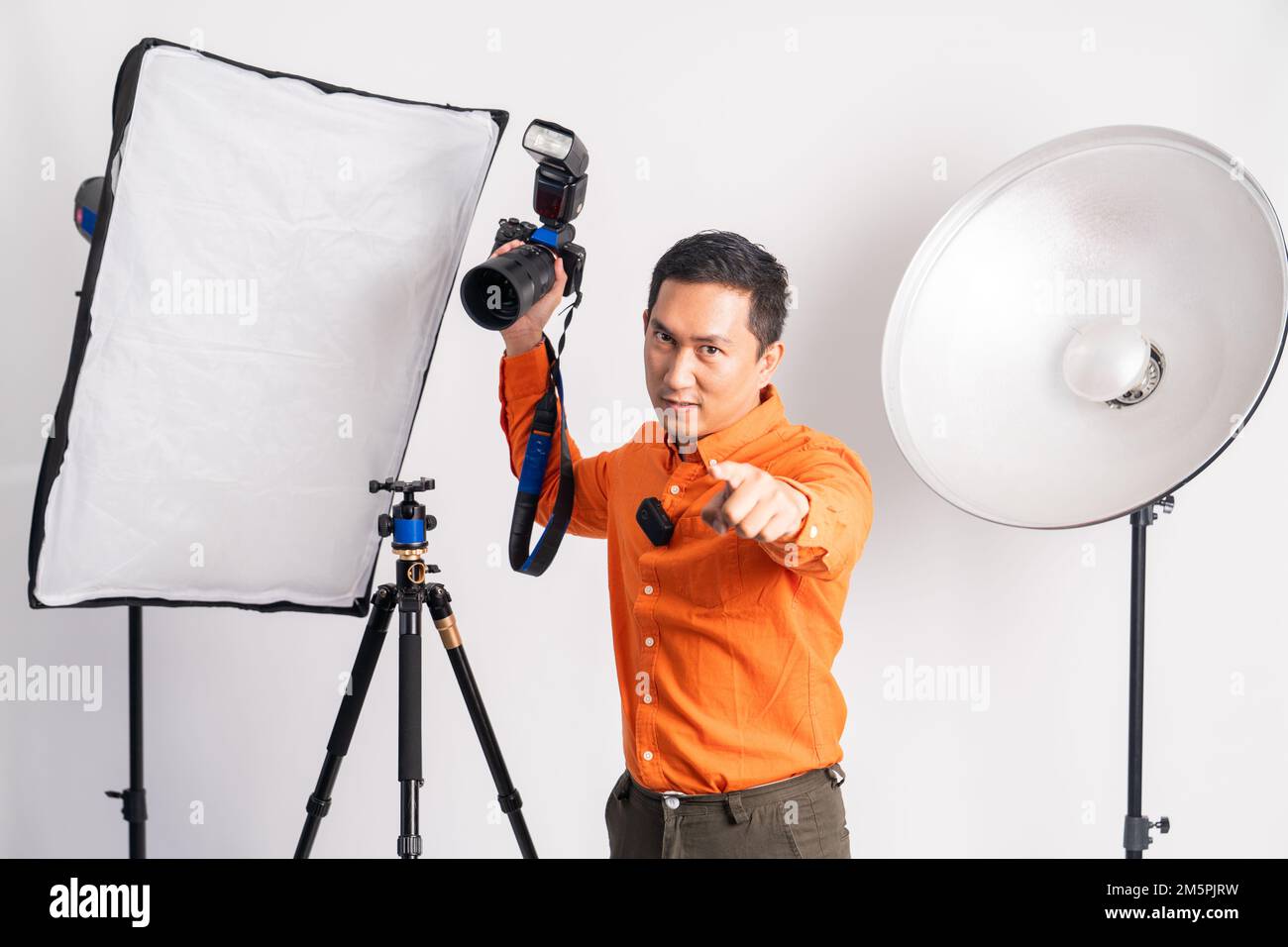 angry photographer with pointing and holding camera to throw Stock ...