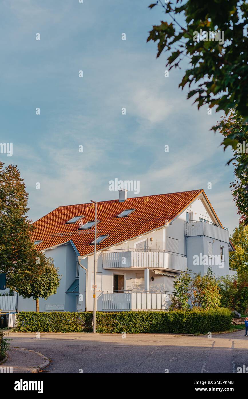 Old white cottage in cozy town. Street view landscape old city, little ...
