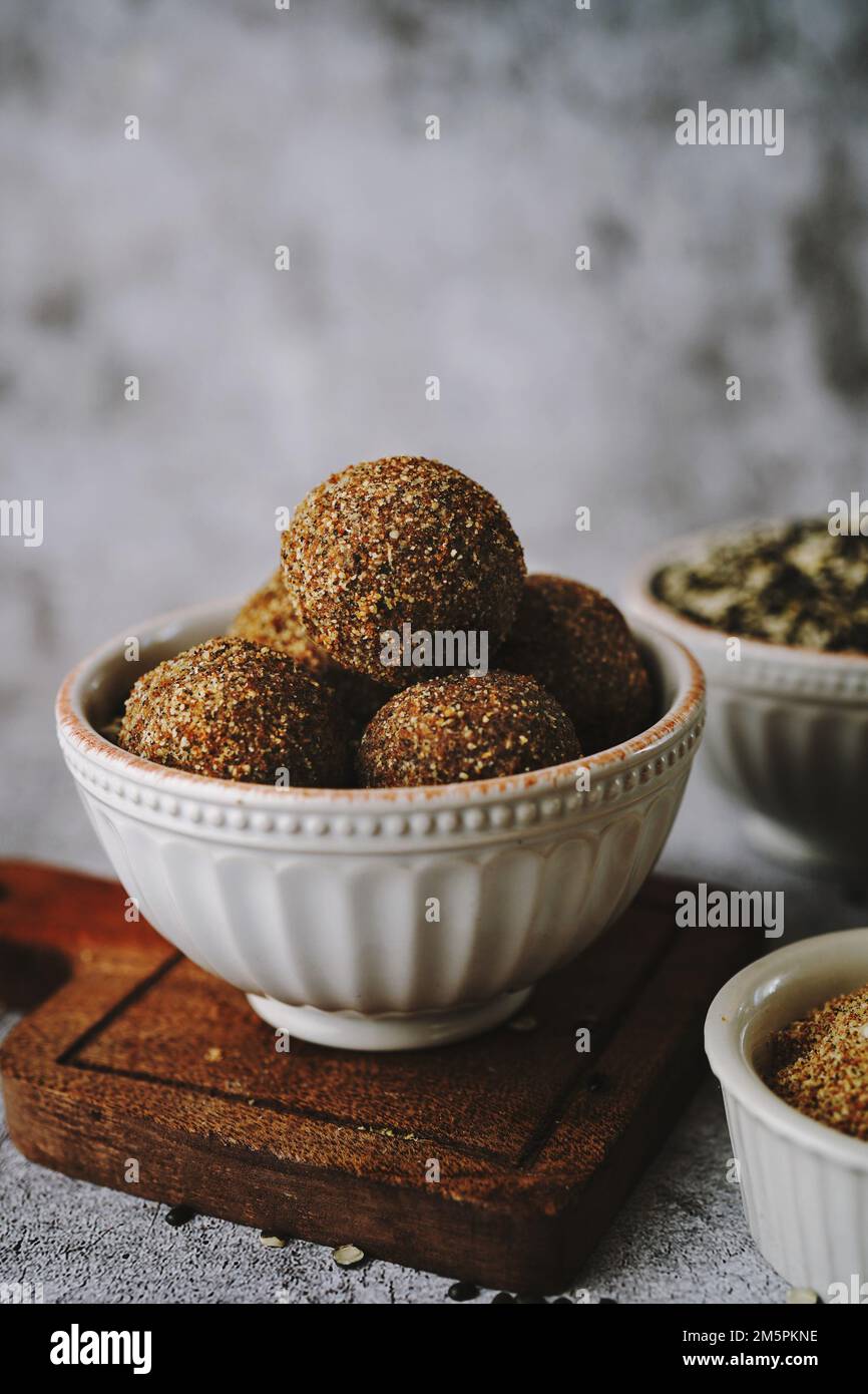 High protein energy balls with black lentils | Urad daal laddu, served ...