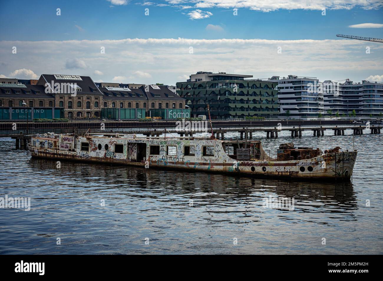 Old, rusty, abandoned shipwreck floating on Spree in Berlin, Germany ...