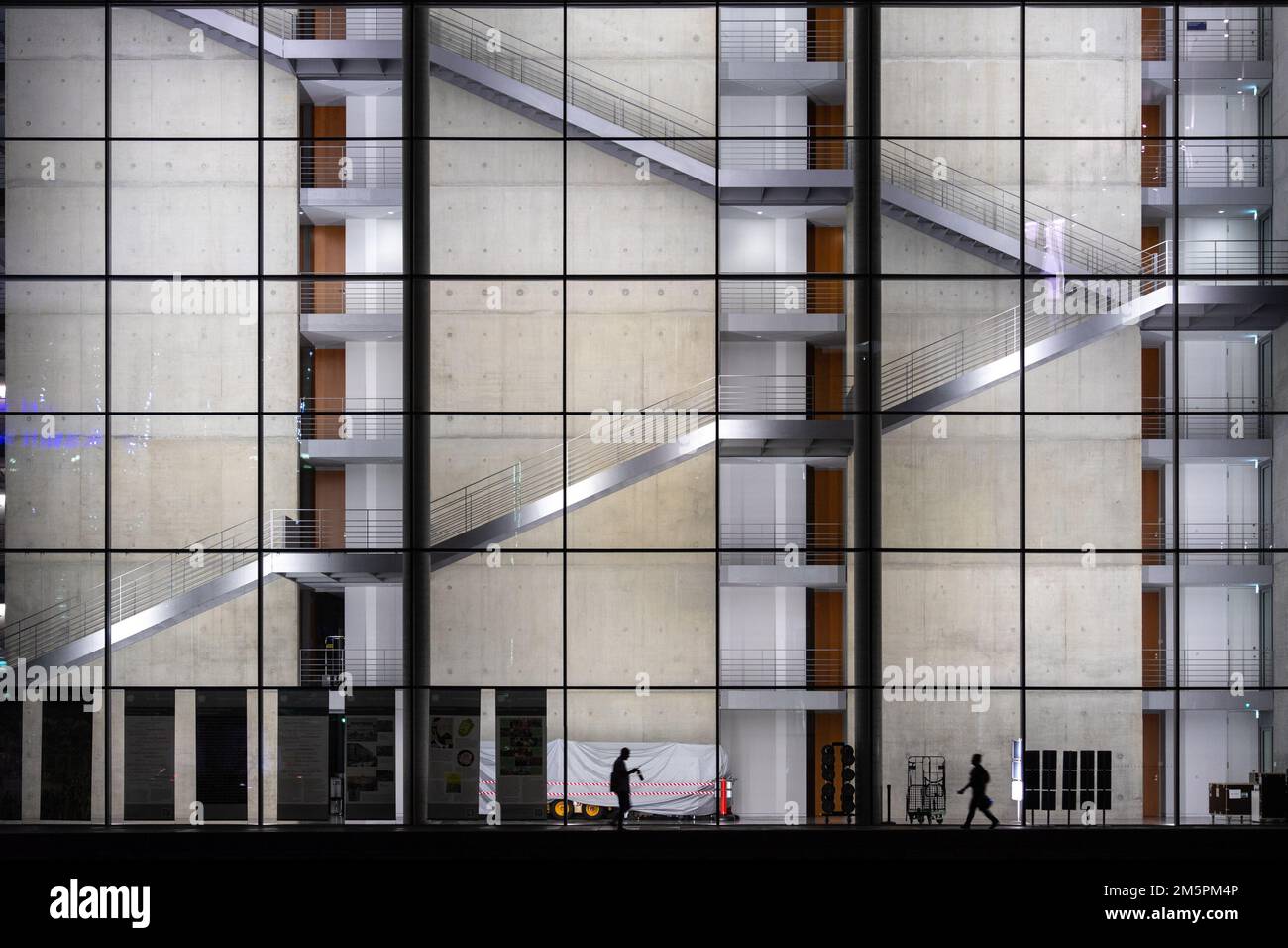 Huge windows of Paul Loebe Building with stairs inside and people ...