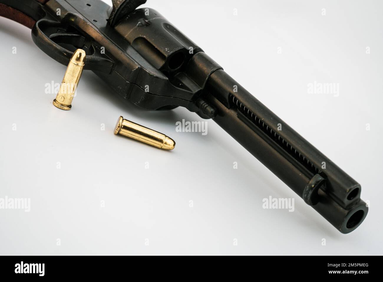 A closeup of a Western Revolver Replica with ammunition isolated on a ...