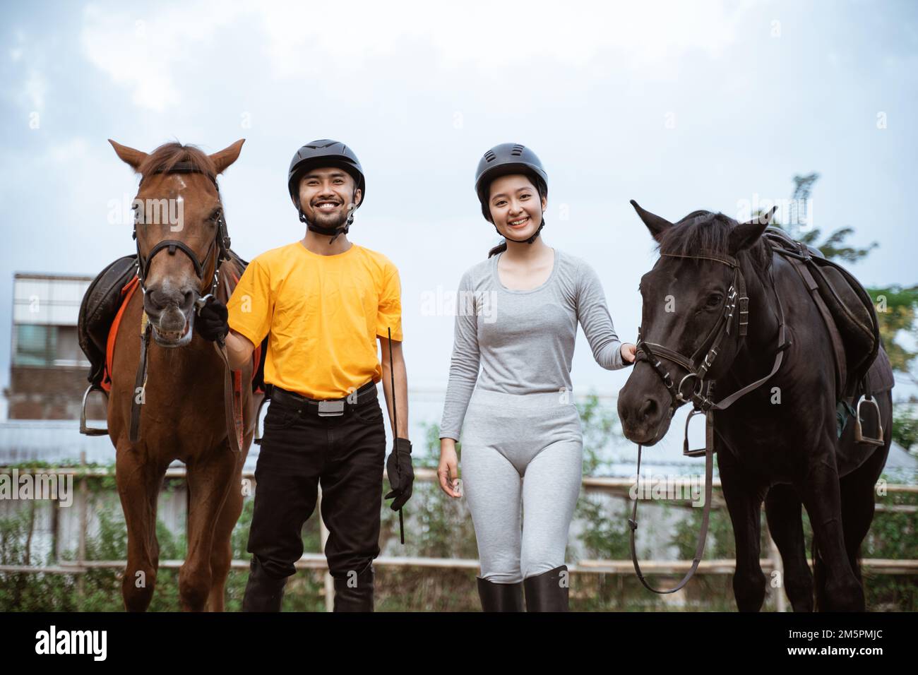 two equestrian athletes ride horses and start training Stock Photo - Alamy