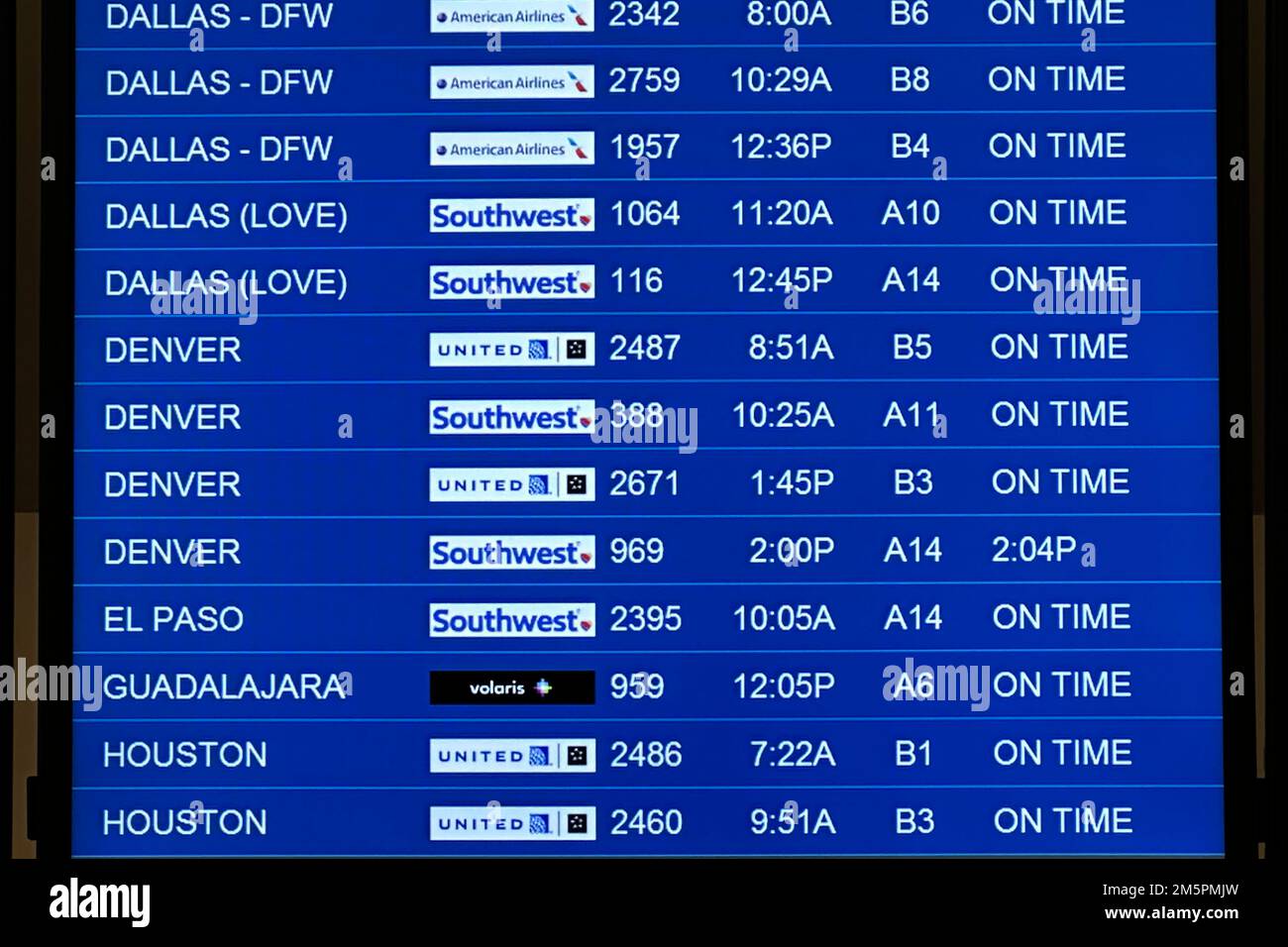 A depatures flight moniitor with on-time and delayed flights for ...