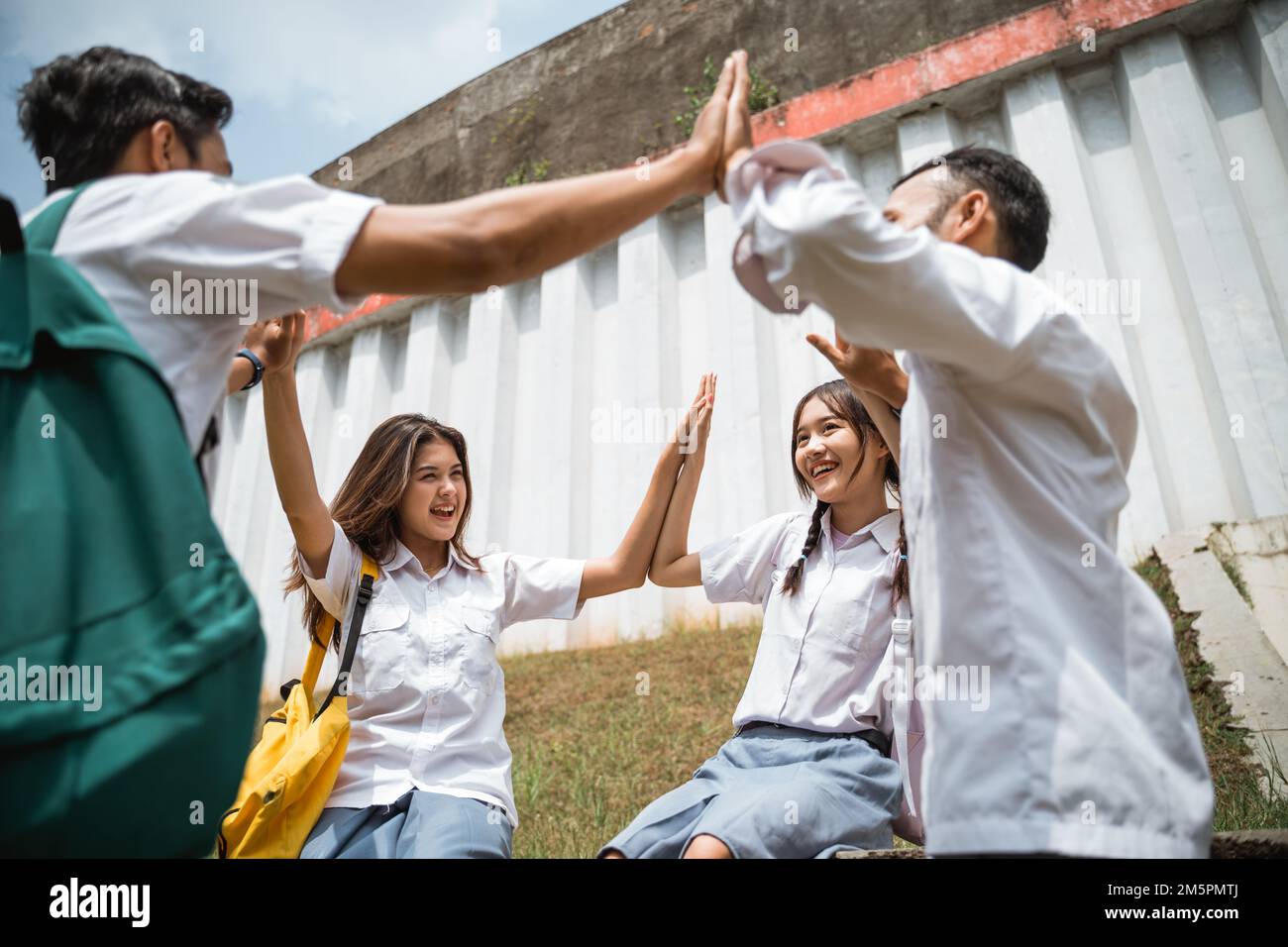 High school students form a symbol of unity Stock Photo - Alamy