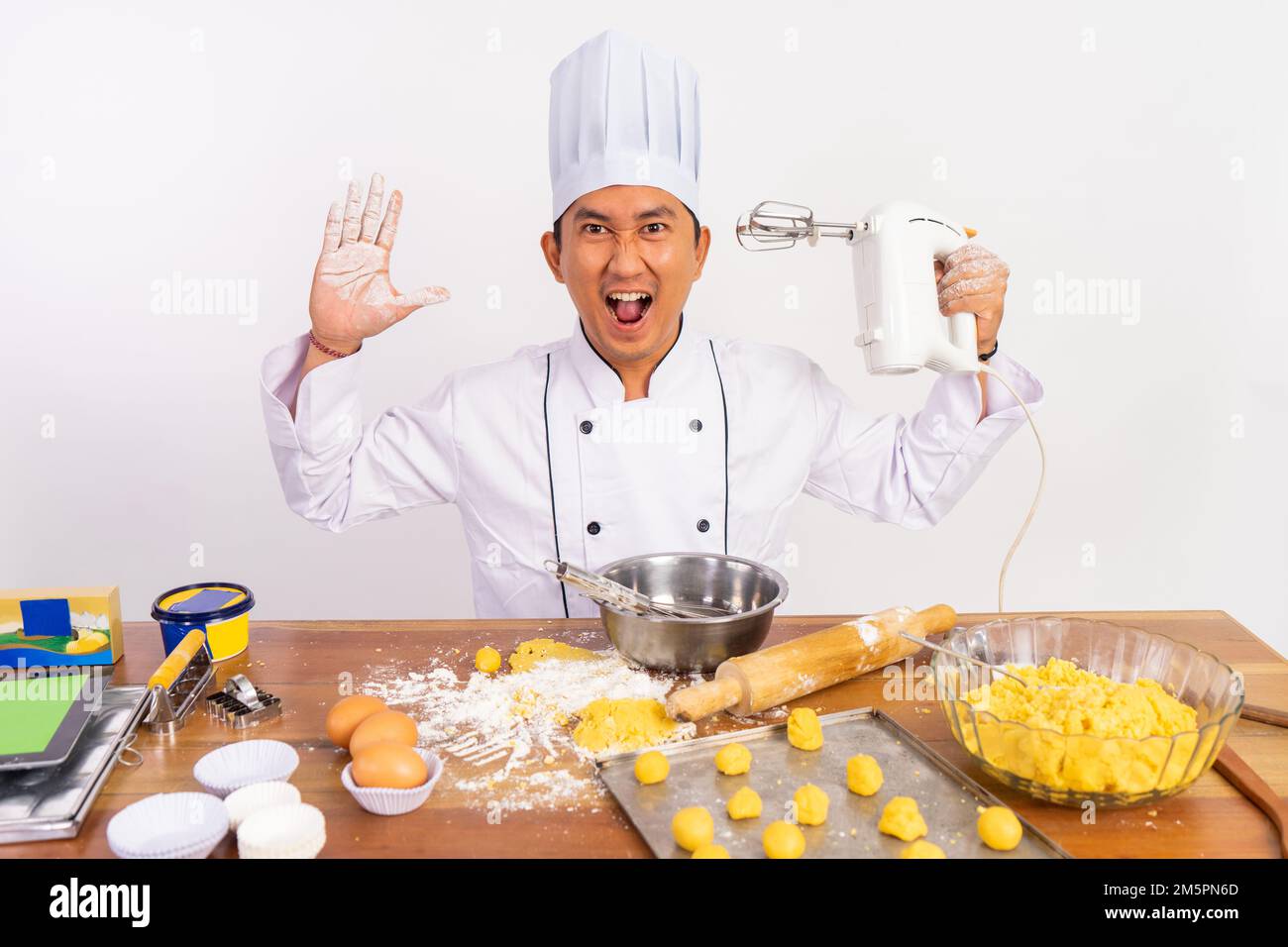 excited male chef holding mixer with camera startling gesture Stock ...