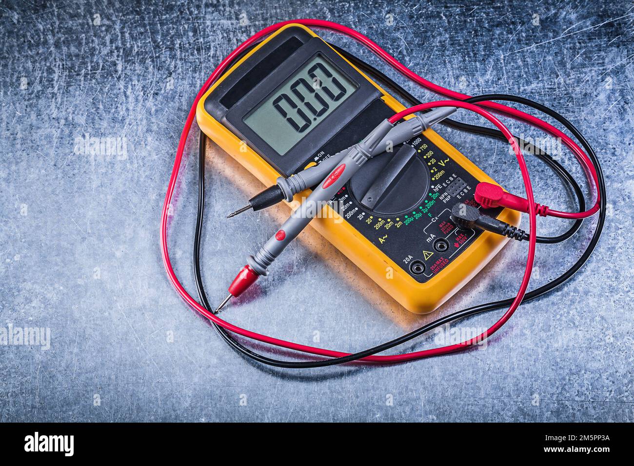 Digital electrical tester on metallic background electricity concept ...
