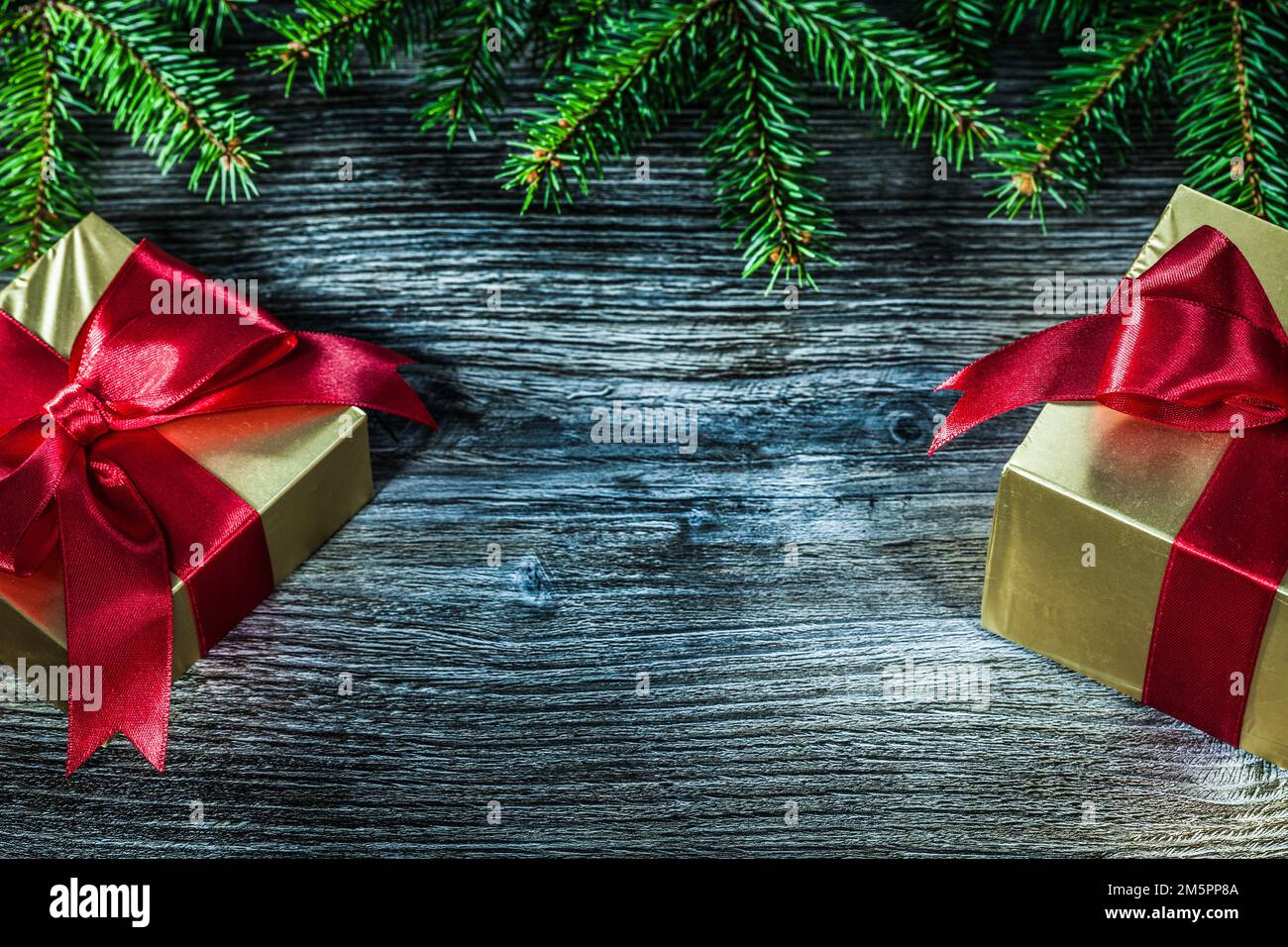 Gift box evergreen branch on wooden board Stock Photo - Alamy