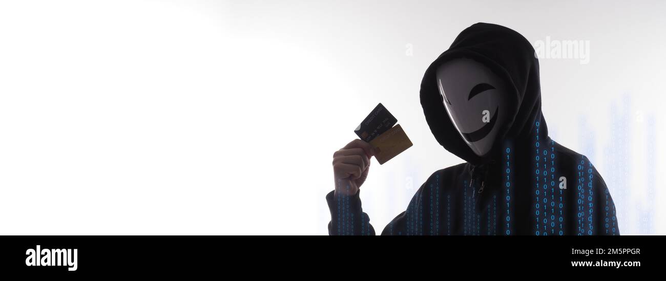 Hacker man and credit cards in hand. Represent credit cards personal ...