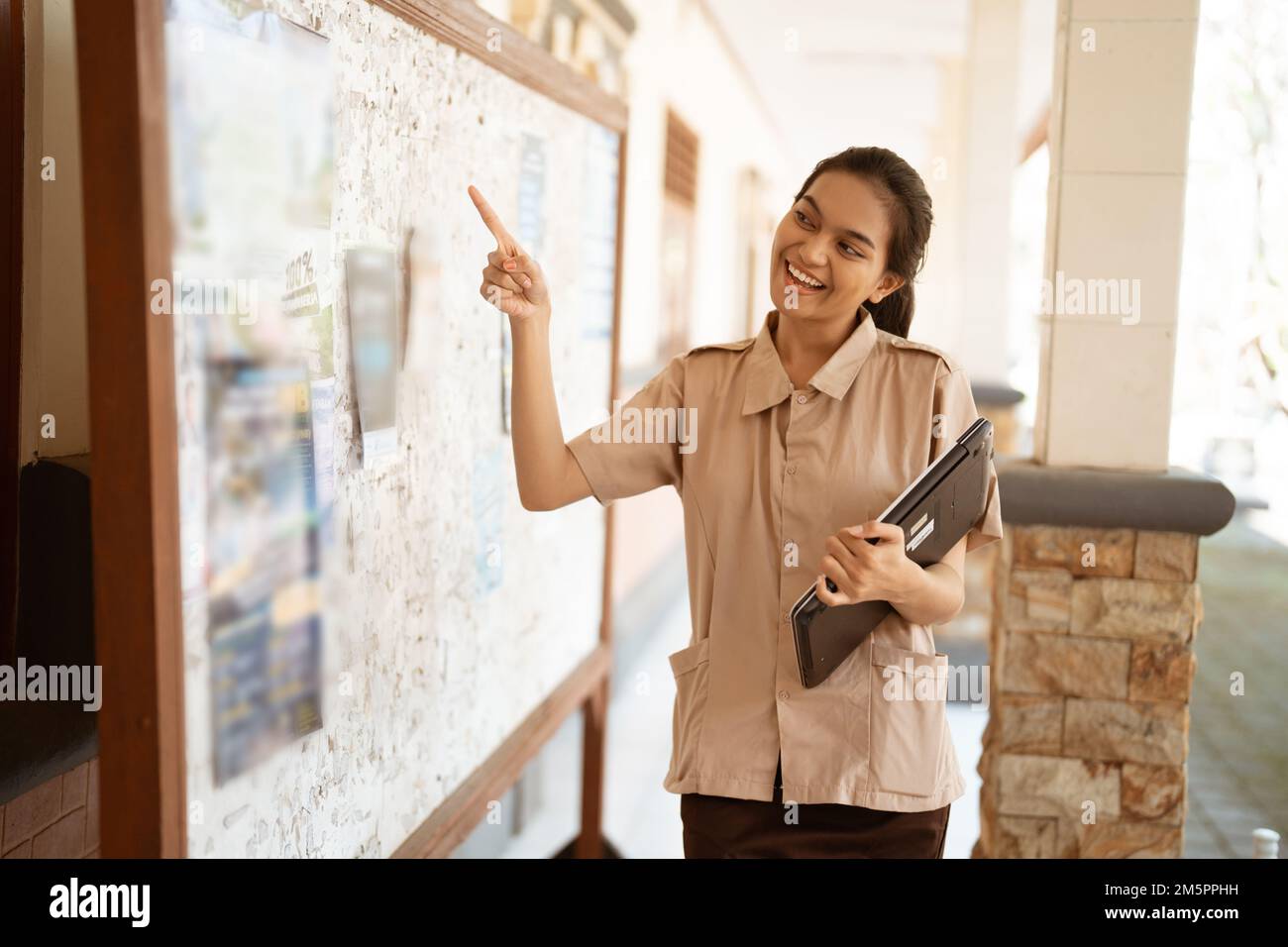 Teenager pointing at school building hi-res stock photography and ...