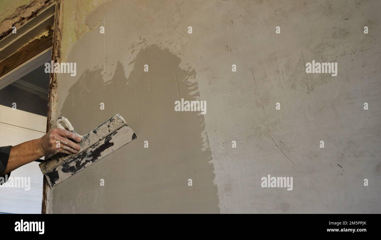 graphic resource with a large copy space on a plastered wall with a ...