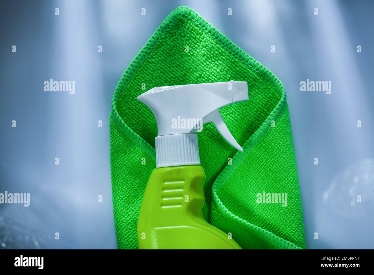Green cleaning cloth sprayer on white background Stock Photo - Alamy