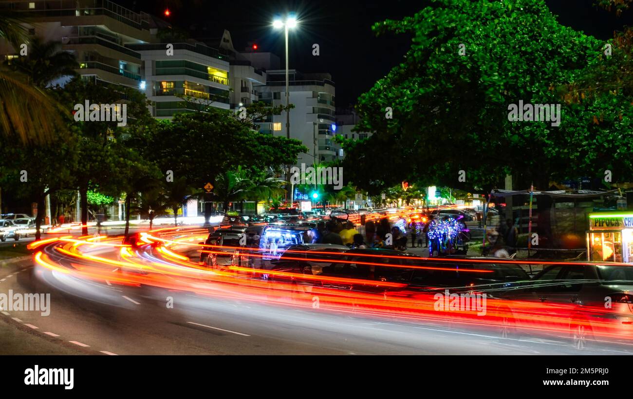 Urban road or avenue in the city. Long exposure with light trails of ...
