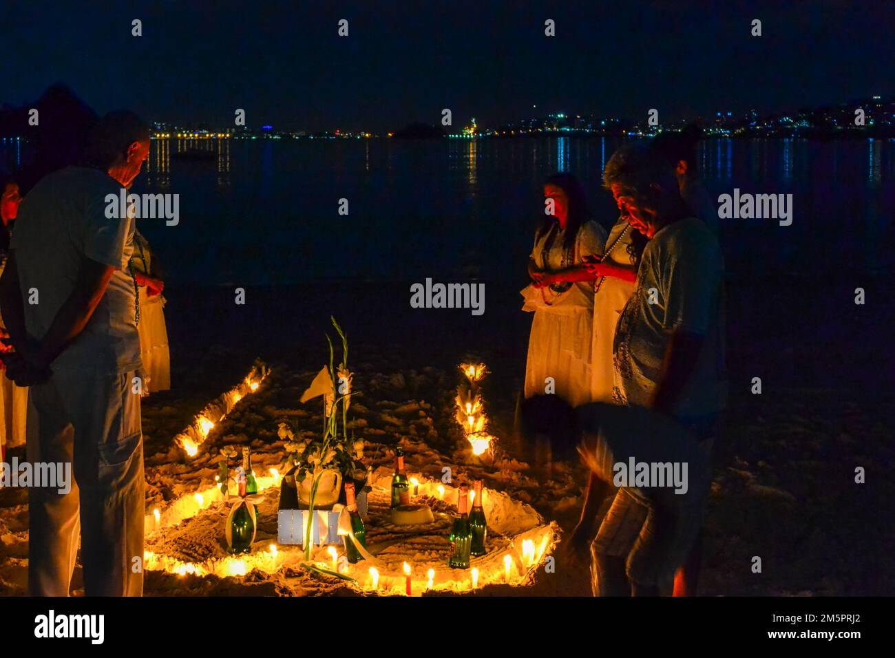 Umbanda religion. A group of people hold a candlelight vigil in the San ...