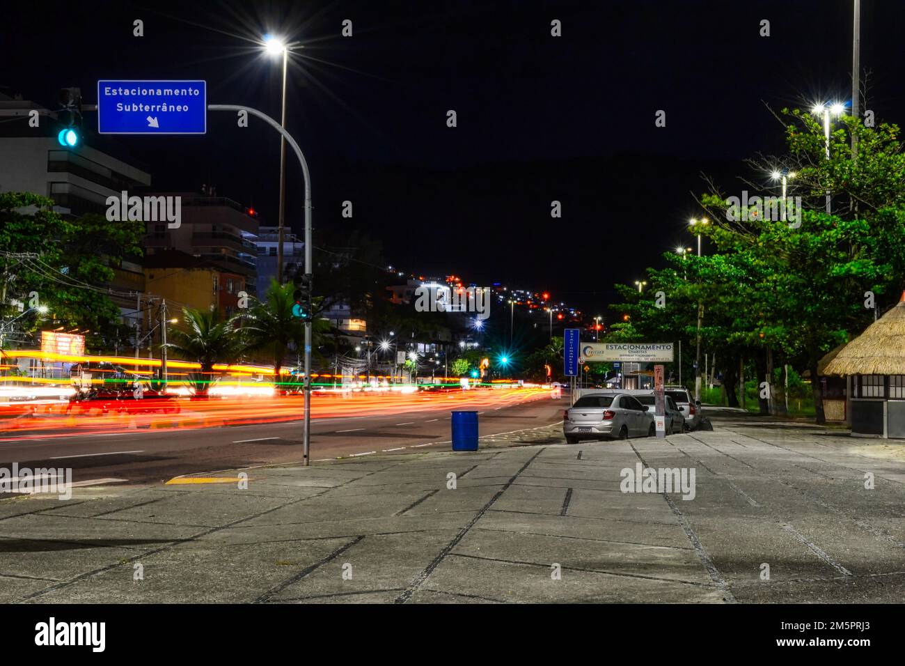 Urban road or avenue in the city. Long exposure with light trails of ...