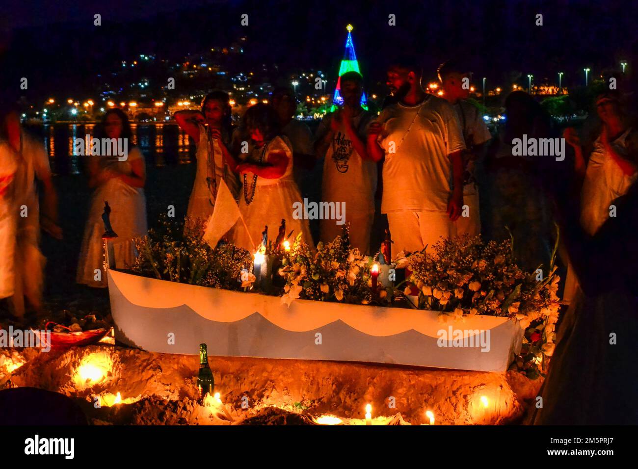 Umbanda religion. A group of people hold a candlelight vigil in the San ...