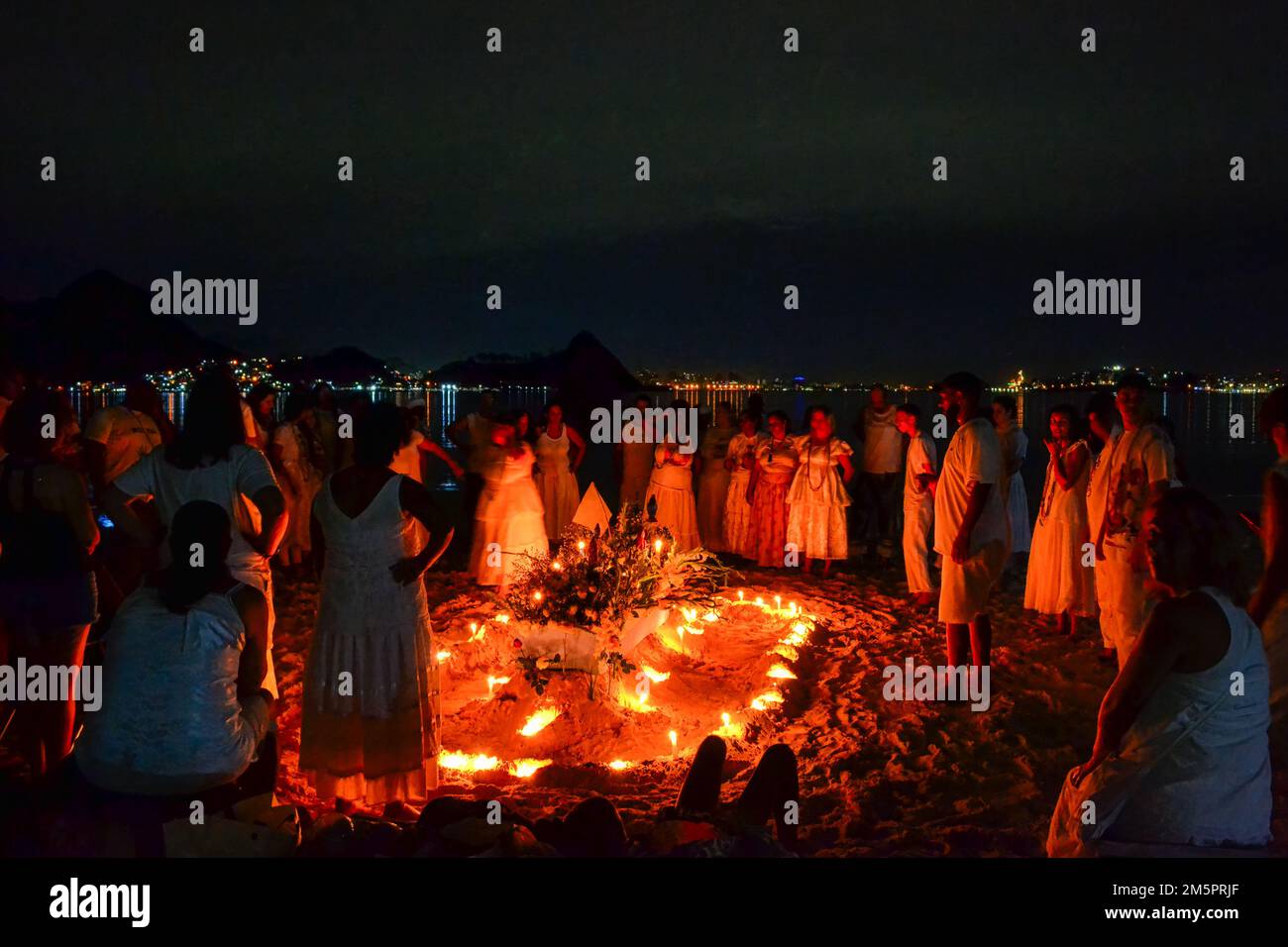 Umbanda religion. A group of people hold a candlelight vigil in the San ...