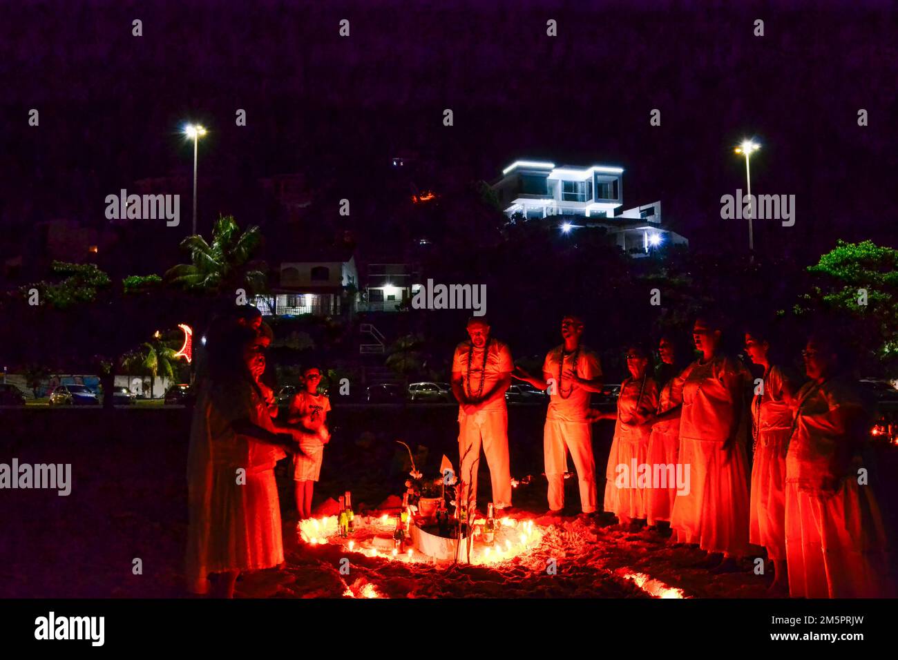 Umbanda religion. A group of people hold a candlelight vigil in the San ...