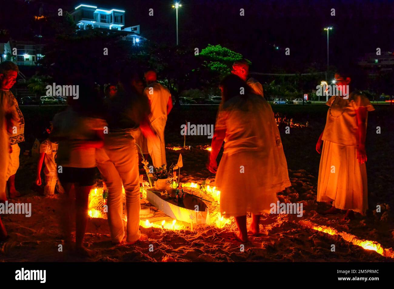 Umbanda religion. A group of people hold a candlelight vigil in the San ...