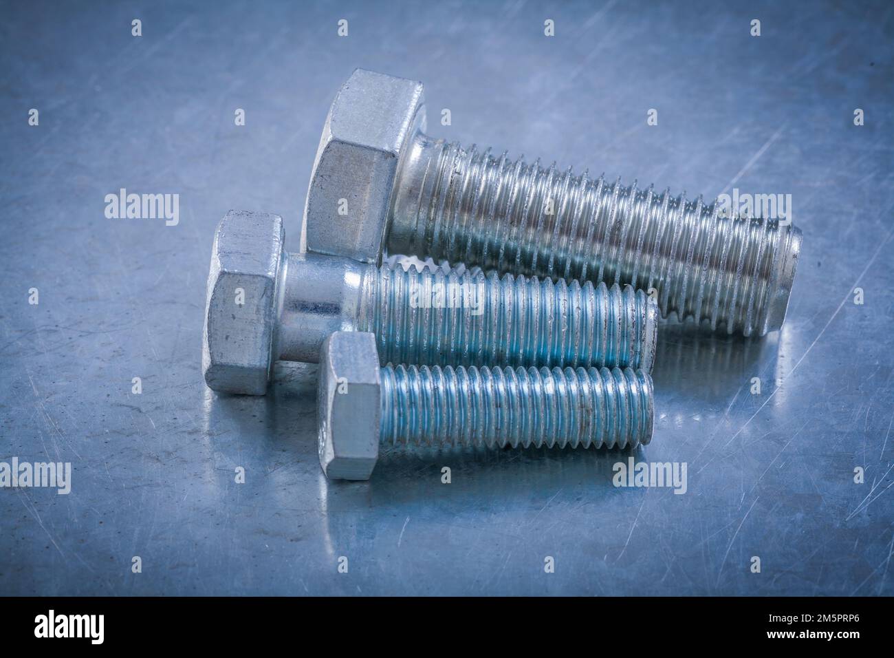Metal construction bolts on metallic background maintenance concept ...