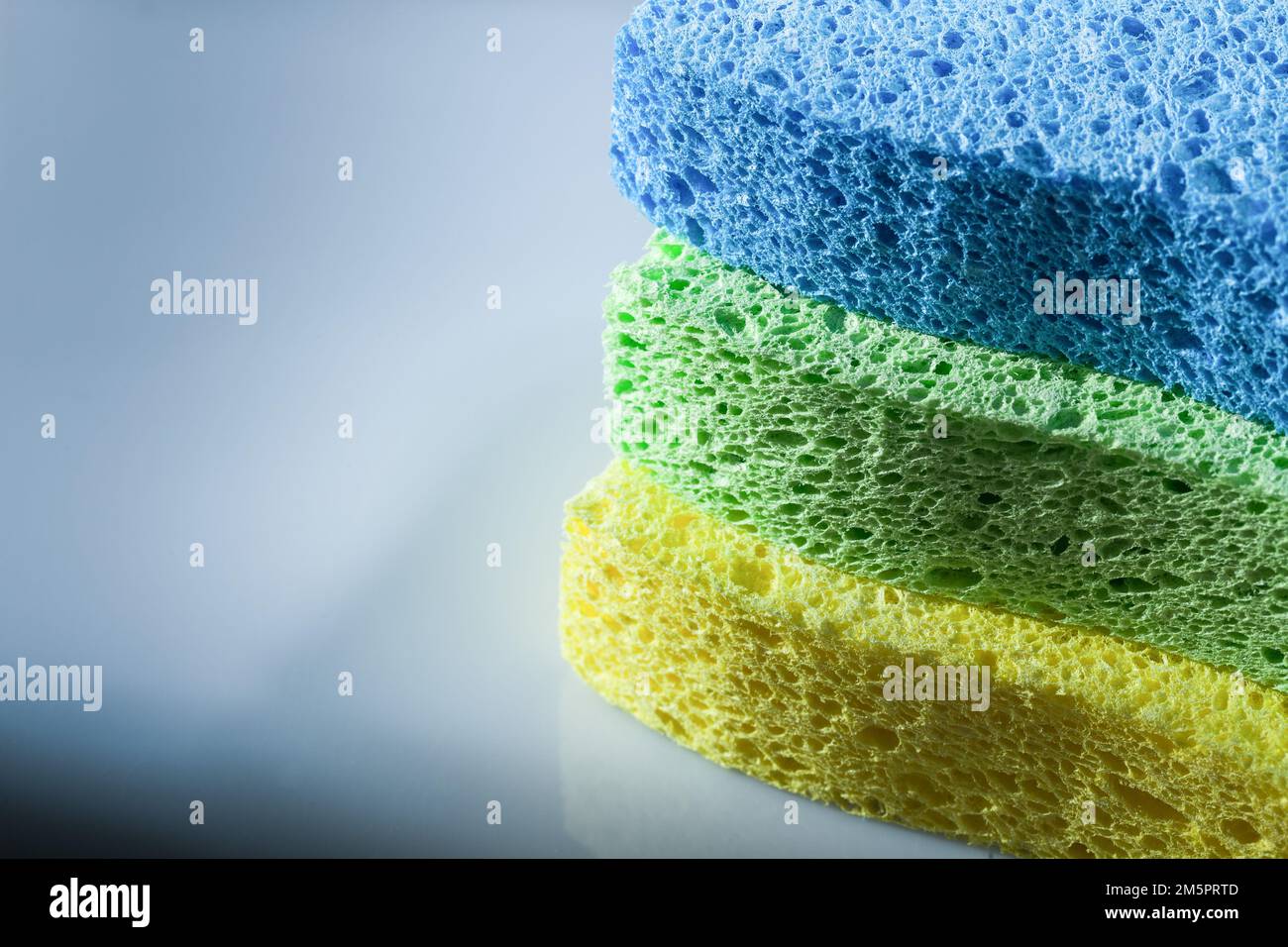 New kitchen sponges on white surface Stock Photo - Alamy
