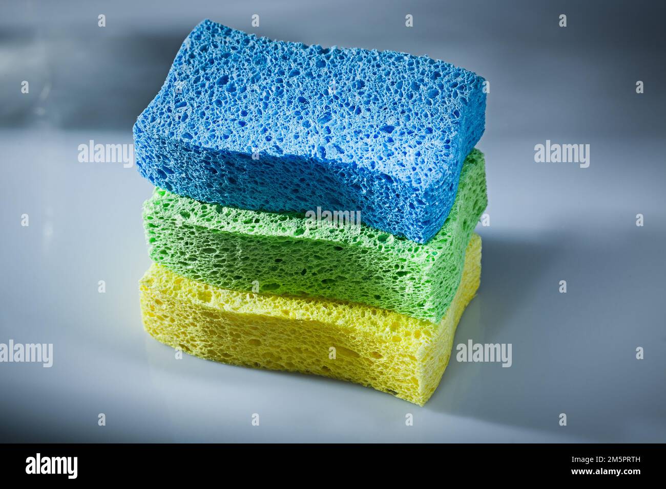 New kitchen sponges on white background Stock Photo - Alamy