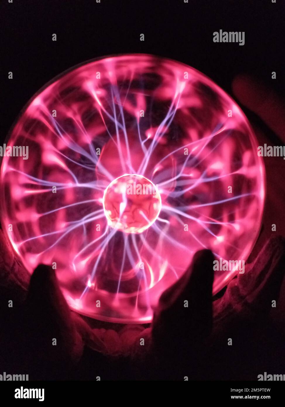 A closeup of a bright plasma globe in the darkness Stock Photo - Alamy