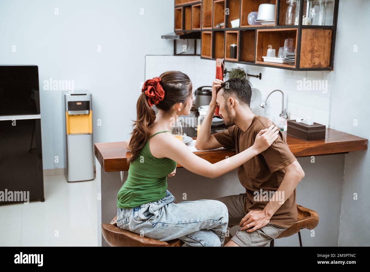 Stressed young men and young women facing problems while chatting Stock ...