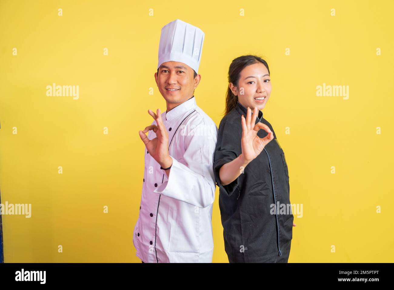 male and female chefs with okay hand gestures Stock Photo - Alamy