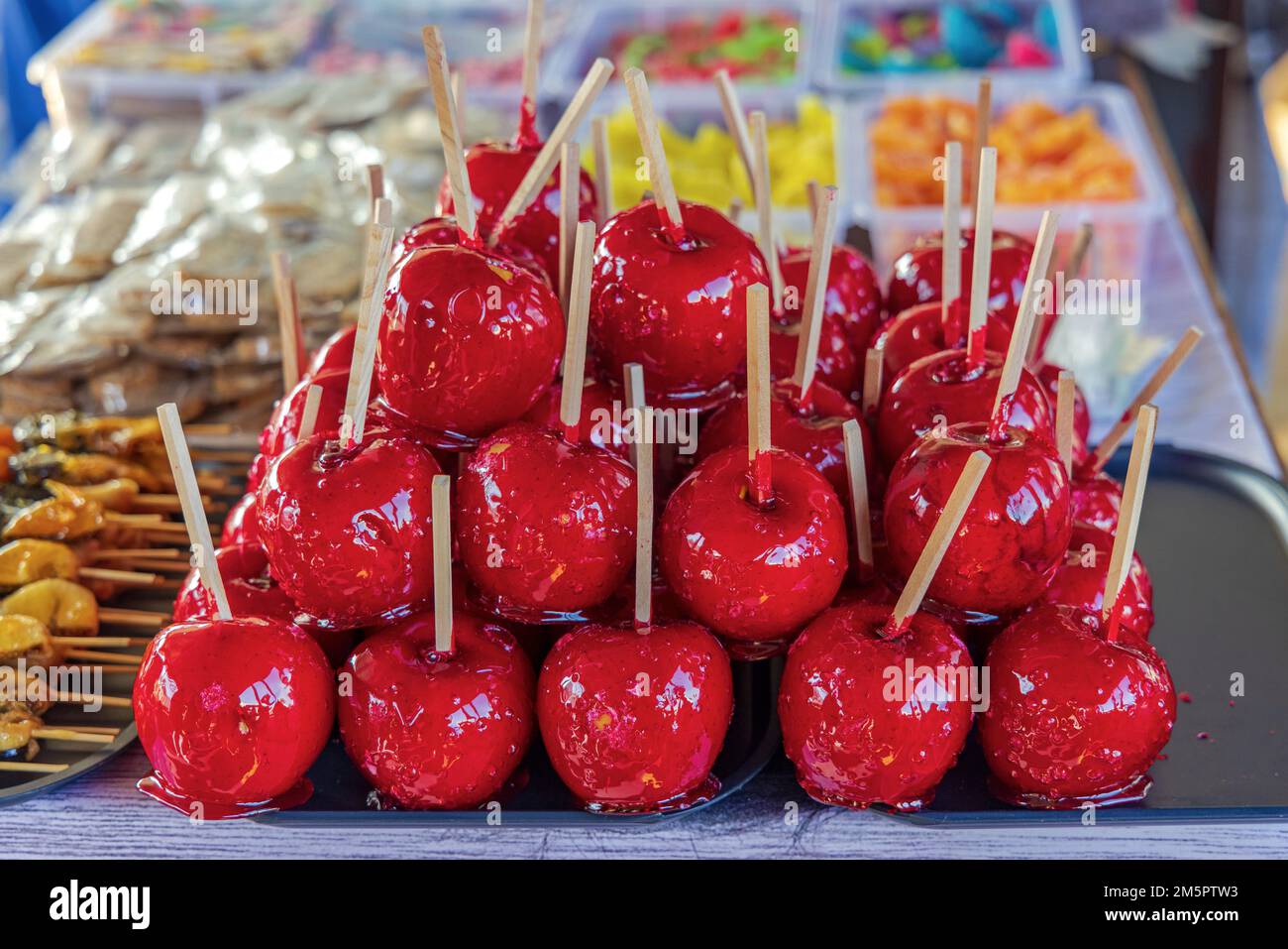 Red Candy Apples for Sale at Fun Fair Winter Festival Stock Photo - Alamy