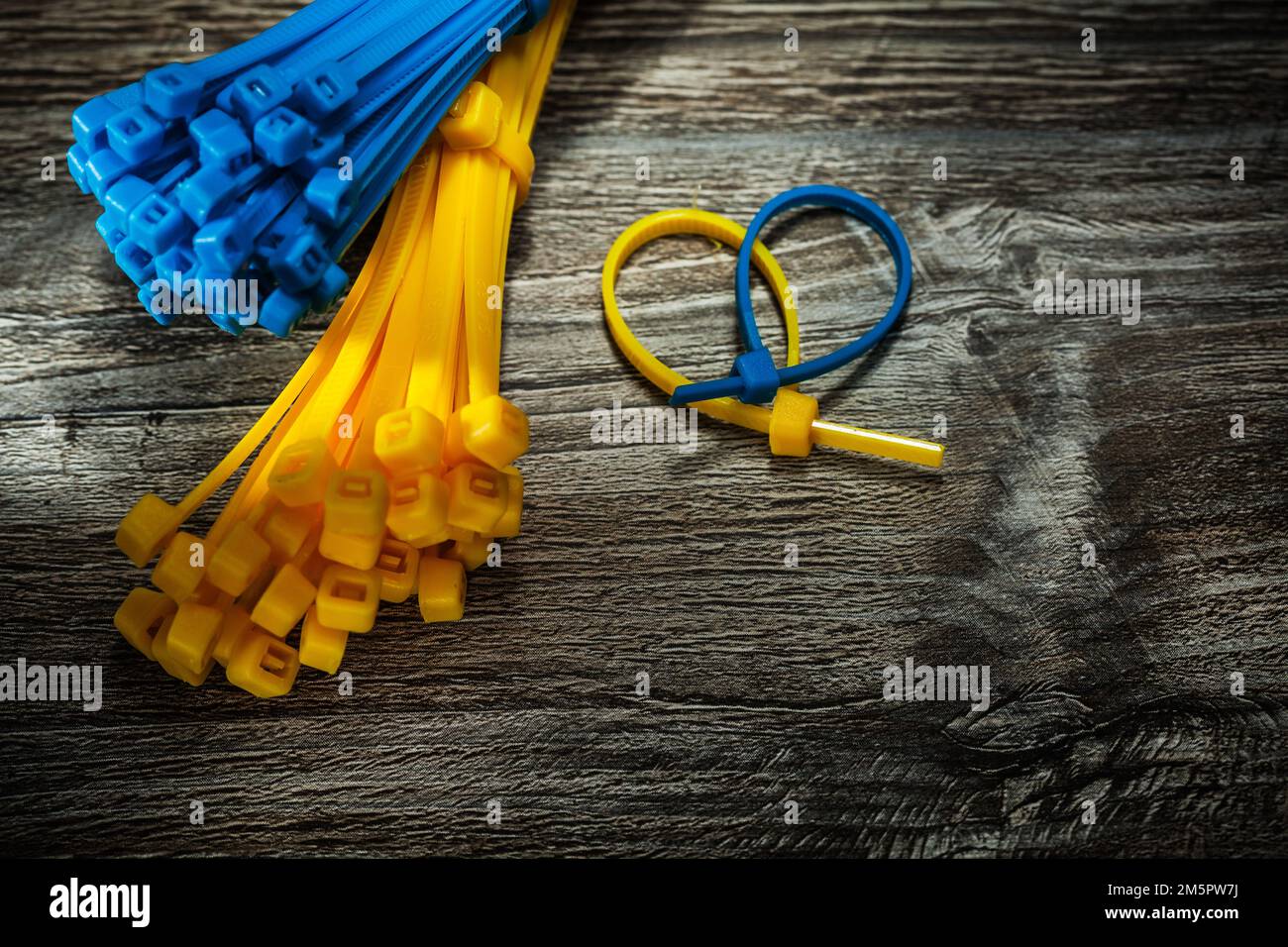 Plastic cables on wooden board Stock Photo - Alamy