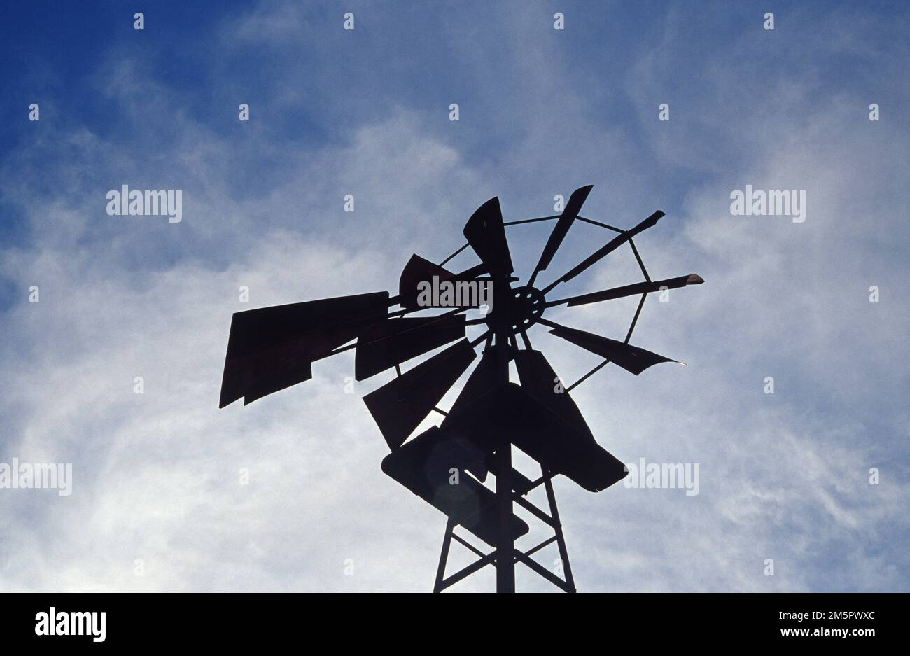 Old wind turbine to raise water for irrigation Stock Photo - Alamy